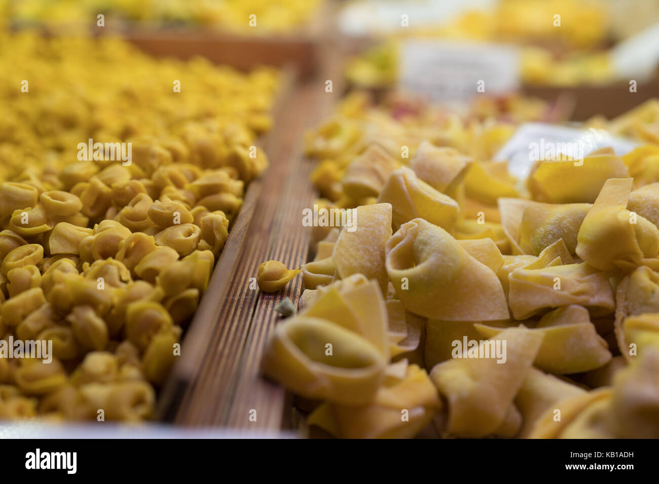 A view of handmade tortellini pasta in a shop window in Bologna. From a ...