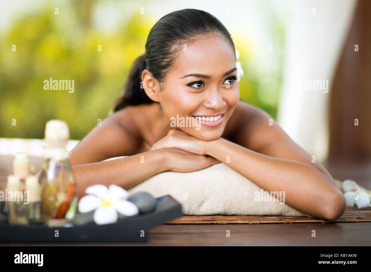 Beautiful smiling girl outdoor portrait at massage spa Stock Photo - Alamy