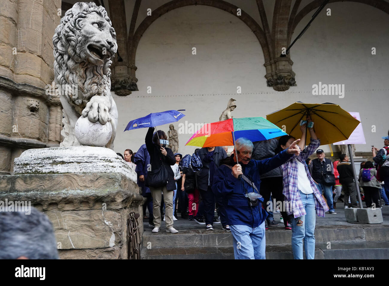 A general view of tourists in the rain in Florence in Italy. From a ...