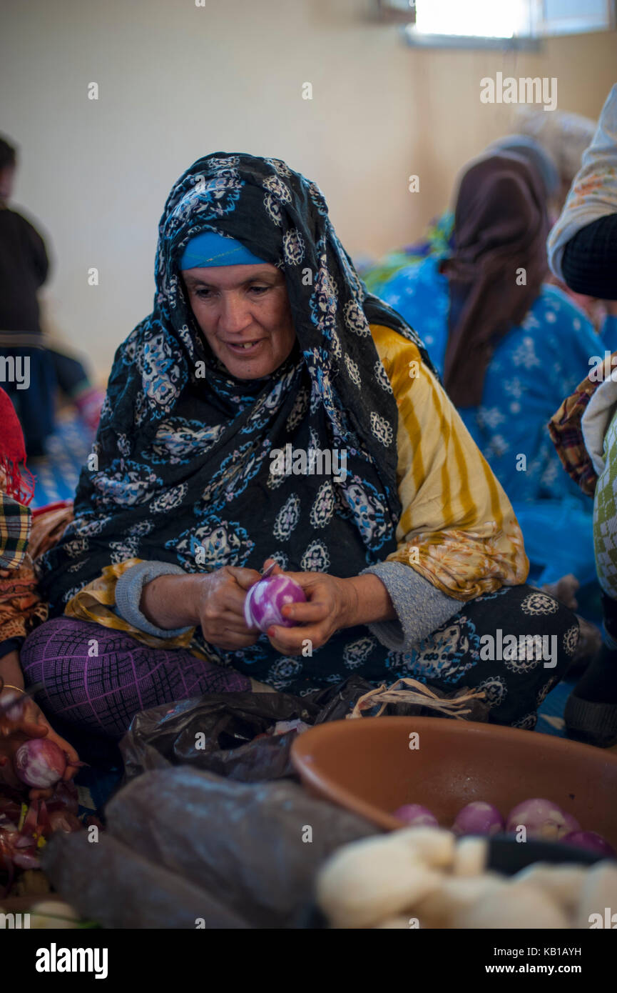 women prepare a meal in Merzouga, Morocco Stock Photo - Alamy