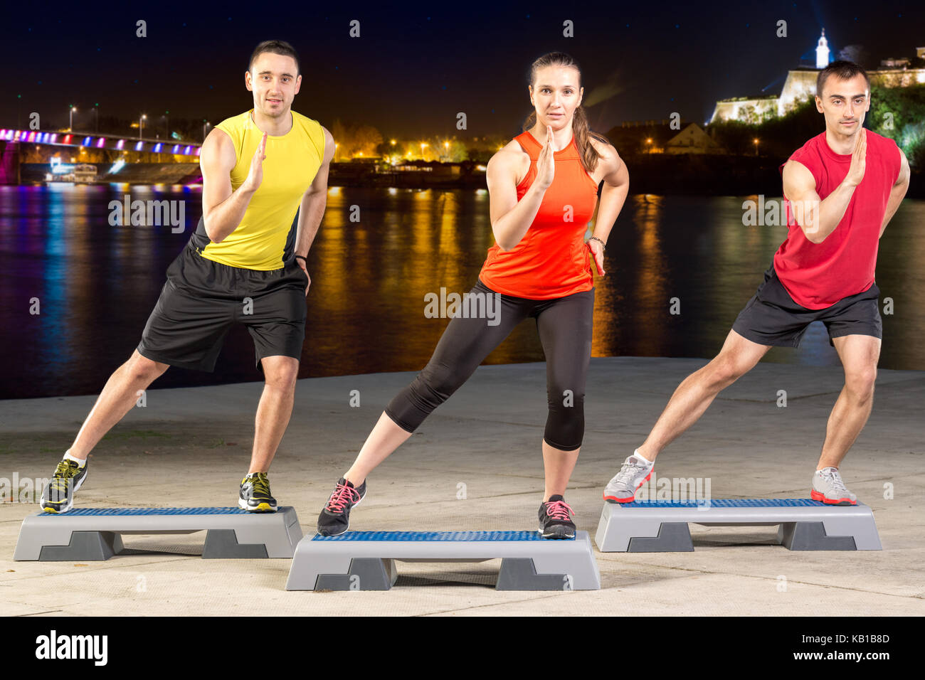 Active young people on outdoor step training Stock Photo - Alamy