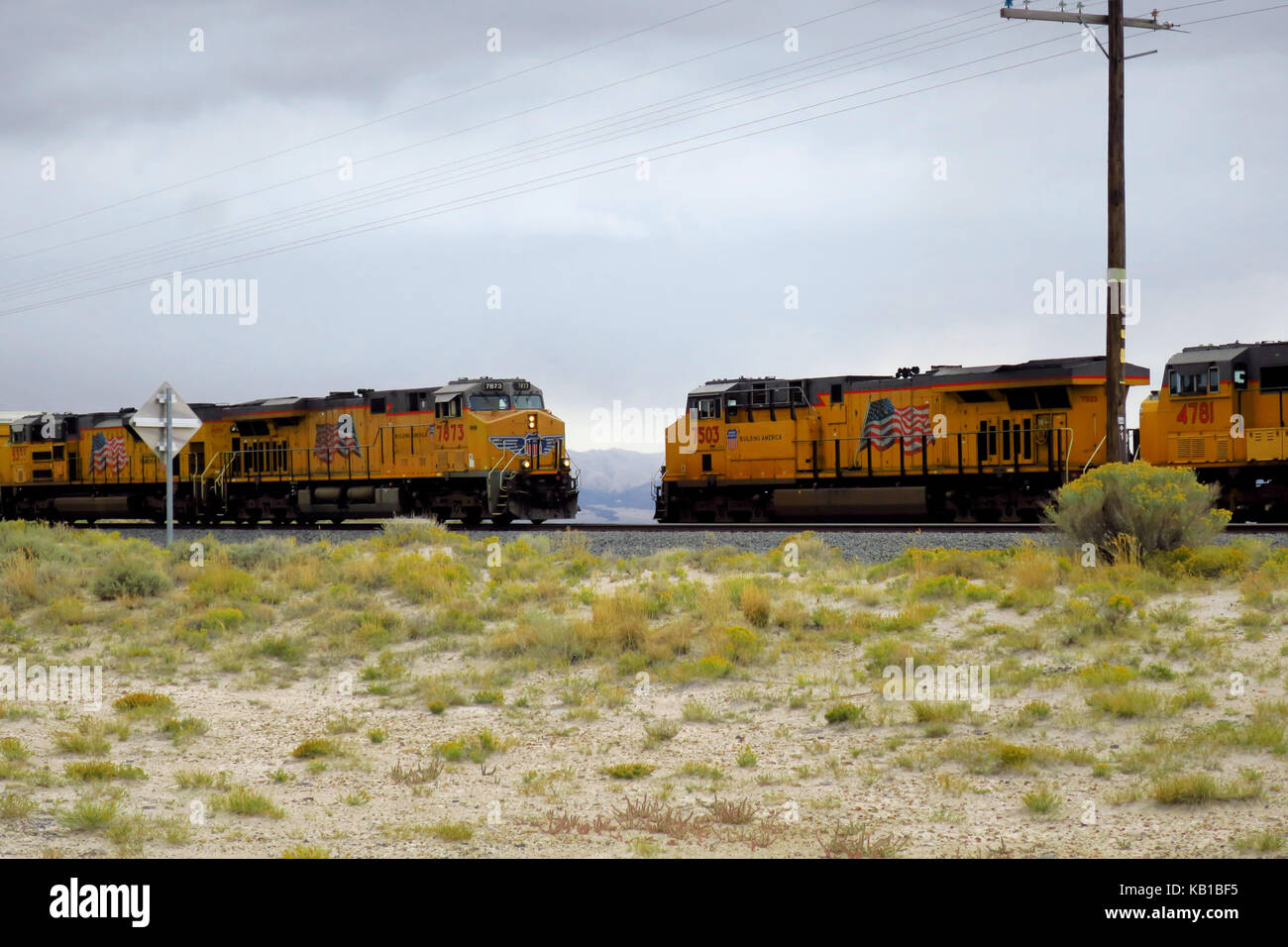 Railway train passing mountains hi-res stock photography and images - Alamy