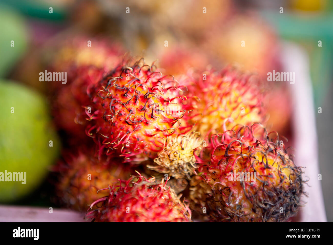 Tropical fruit, rambutan on market at Bali Stock Photo - Alamy