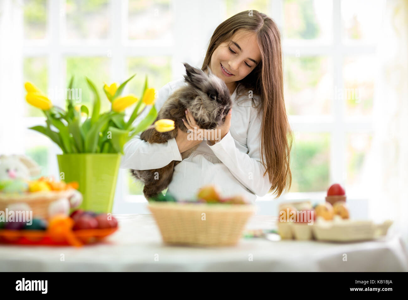 Cute little girl holding adorable bunny Stock Photo - Alamy