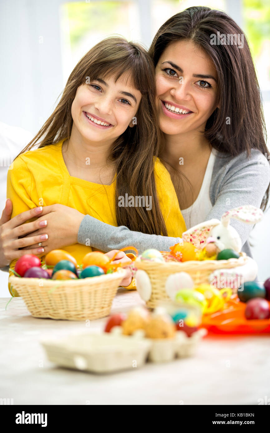 Happy mother embracing her daughter, Easter Stock Photo - Alamy