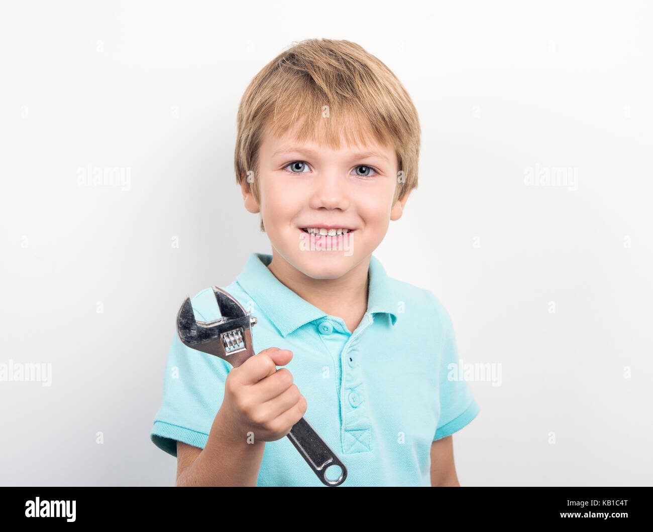 little boy with a wrench Stock Photo - Alamy