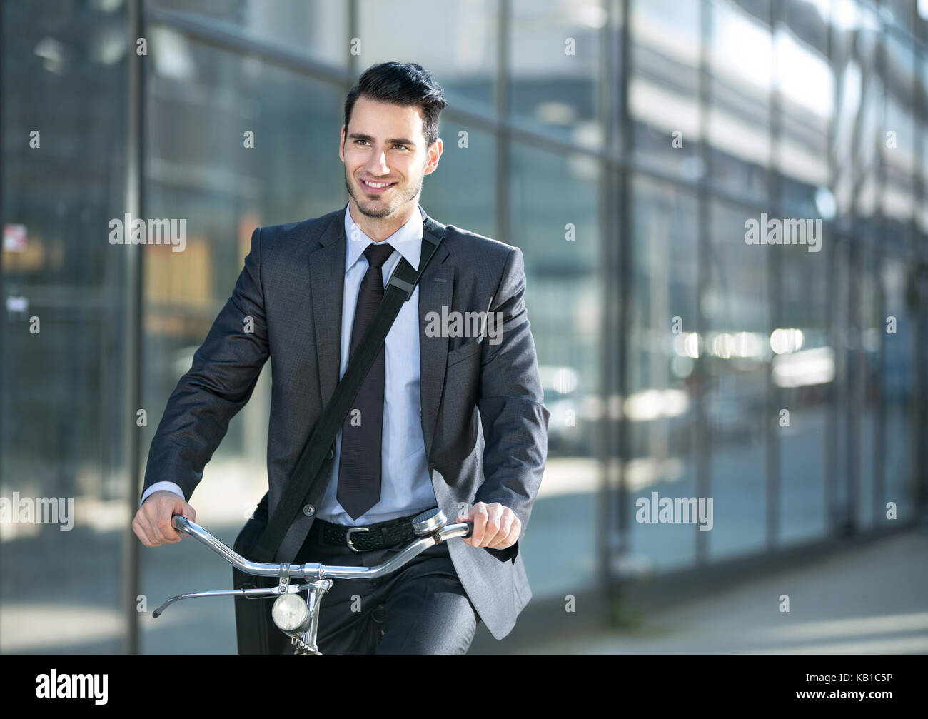 active businessman riding a bicycle on the way to job Stock Photo - Alamy