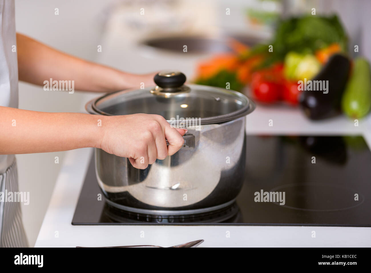 Female hands holding saucepan, cooking Stock Photo - Alamy