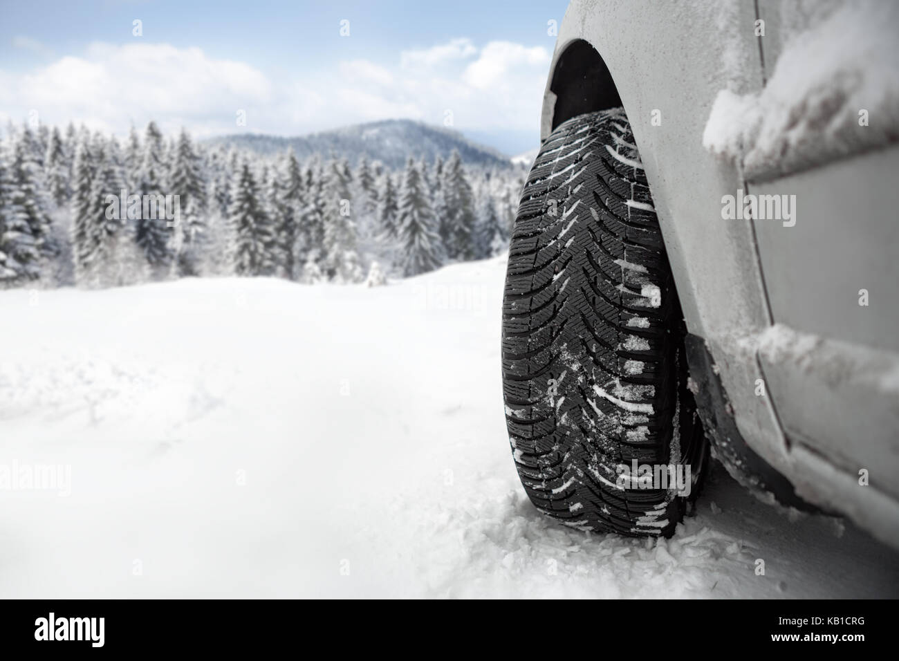 Winter tire in snow – close up Stock Photo - Alamy
