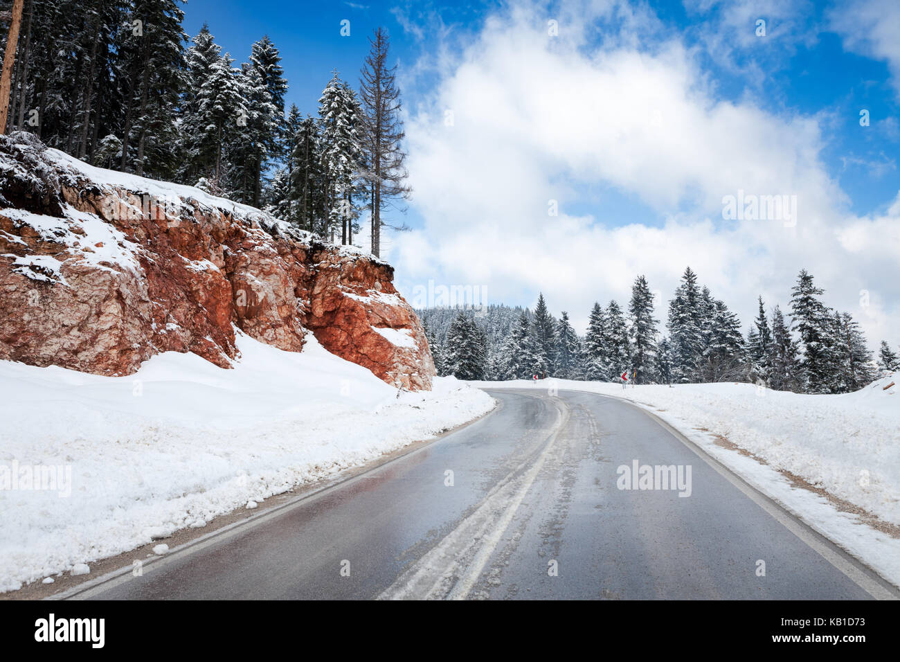 Empty snow covered road in winter landscape Stock Photo - Alamy