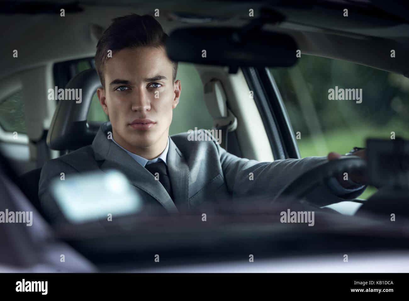 elegance serious stylish men in car Stock Photo - Alamy