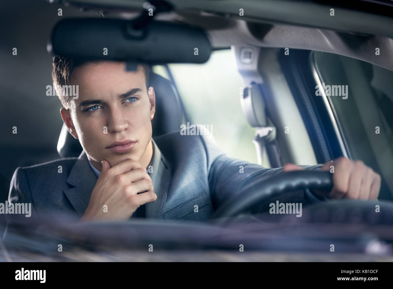 elegance young man driving his car Stock Photo - Alamy
