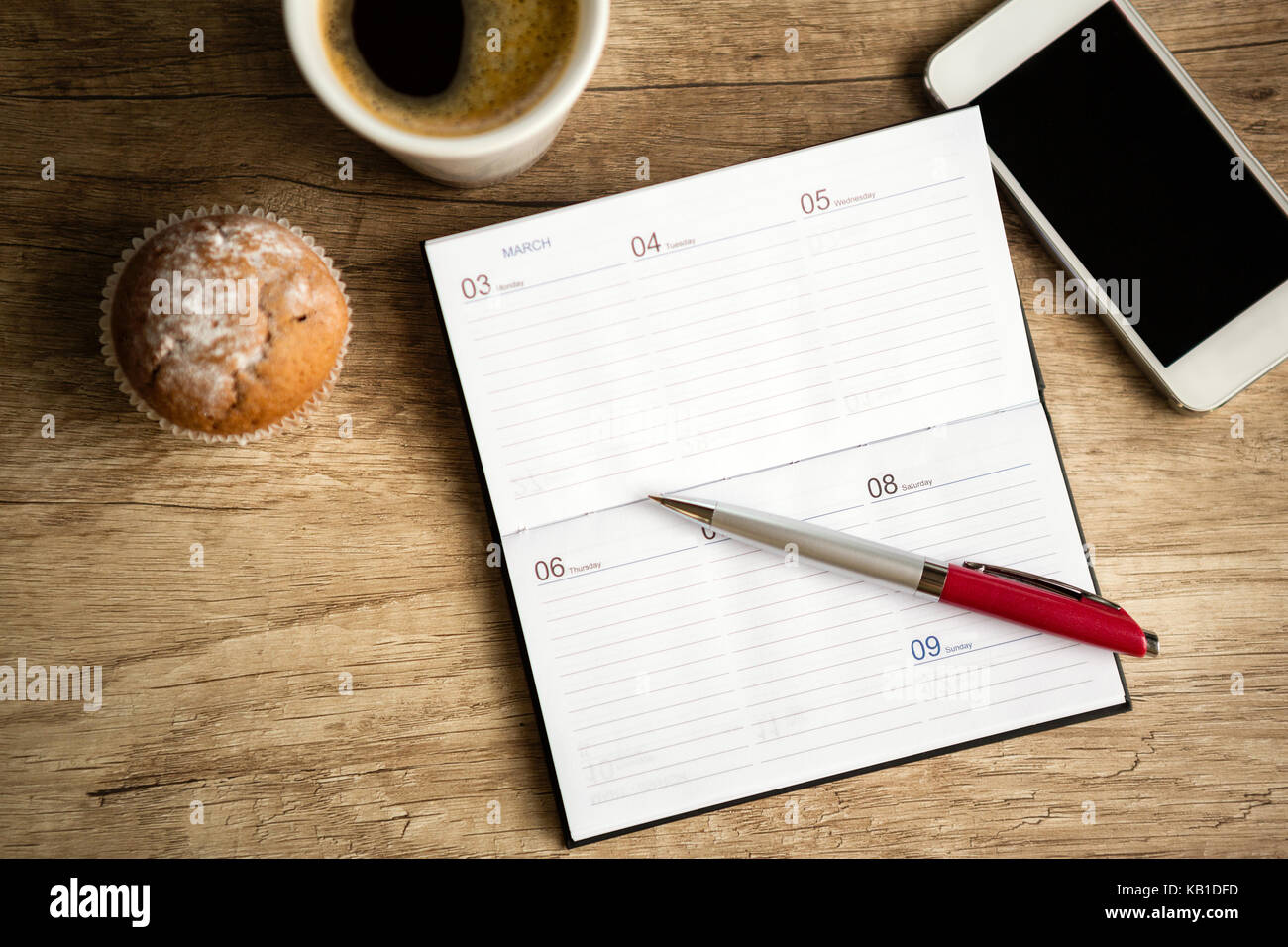 Open notebook on wooden desk, planning workweek Stock Photo - Alamy