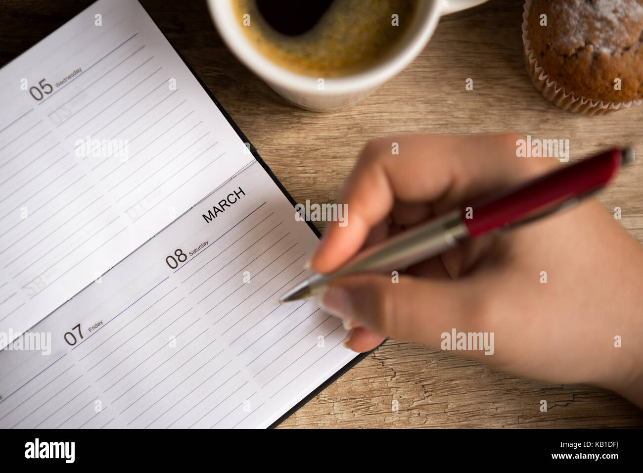 Female hand with notebook marks 8 March Stock Photo - Alamy