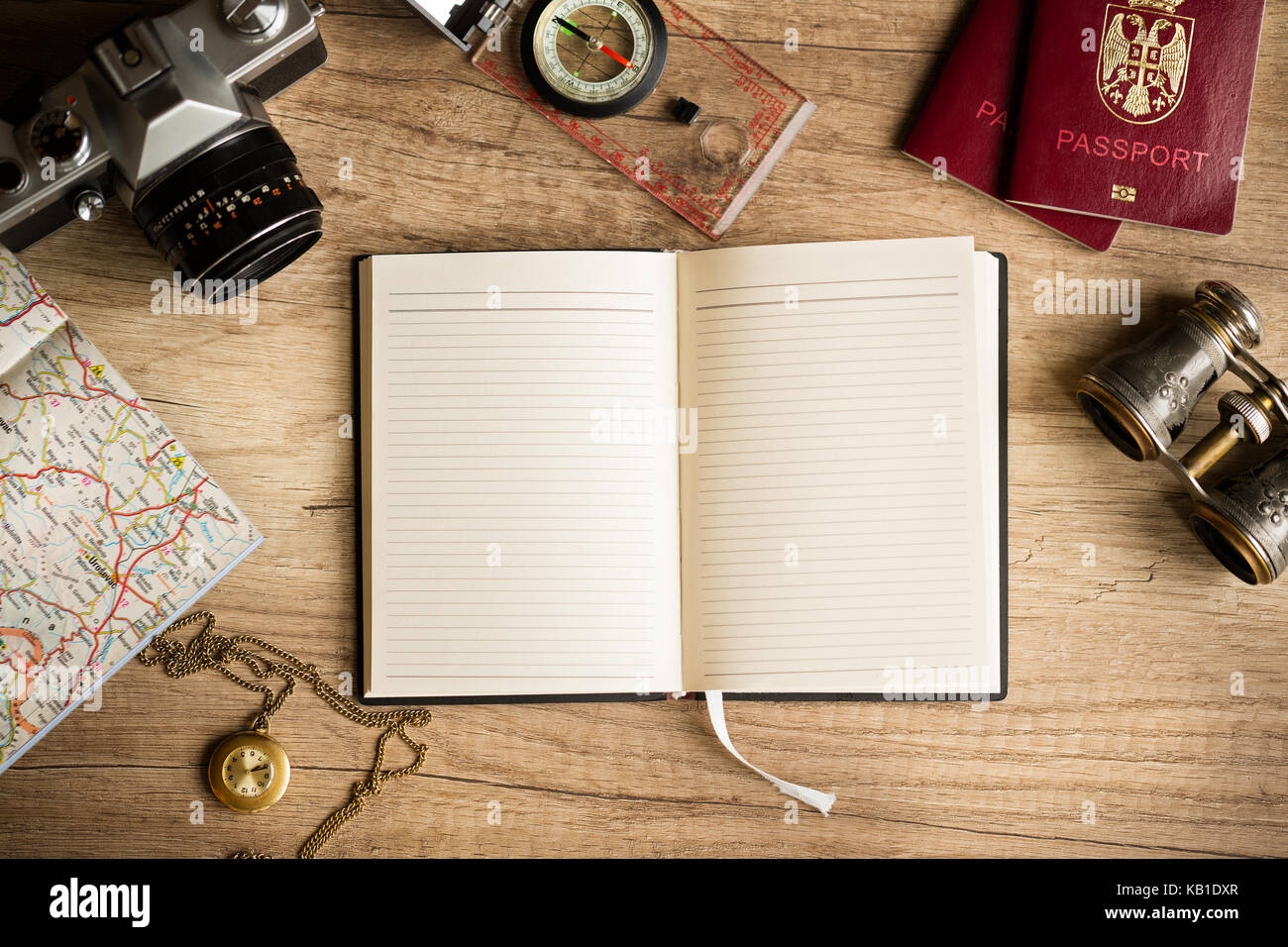 Old notebook, compass, map, vintage binoculars, photo camera on wooden background Stock Photo ...