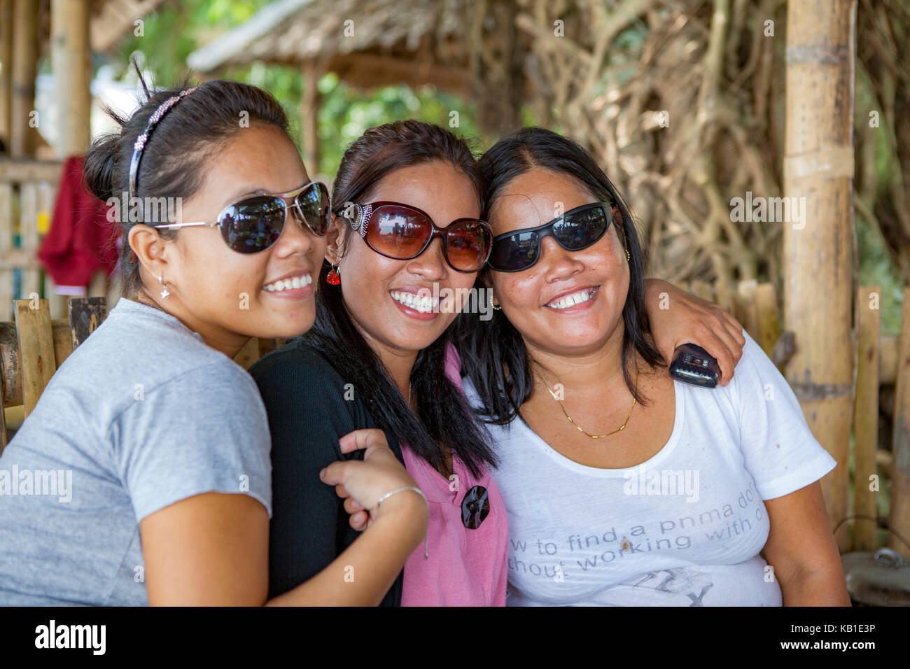 Portrait of Filipino sisters with their mother in Ormoc City, Leyte ...