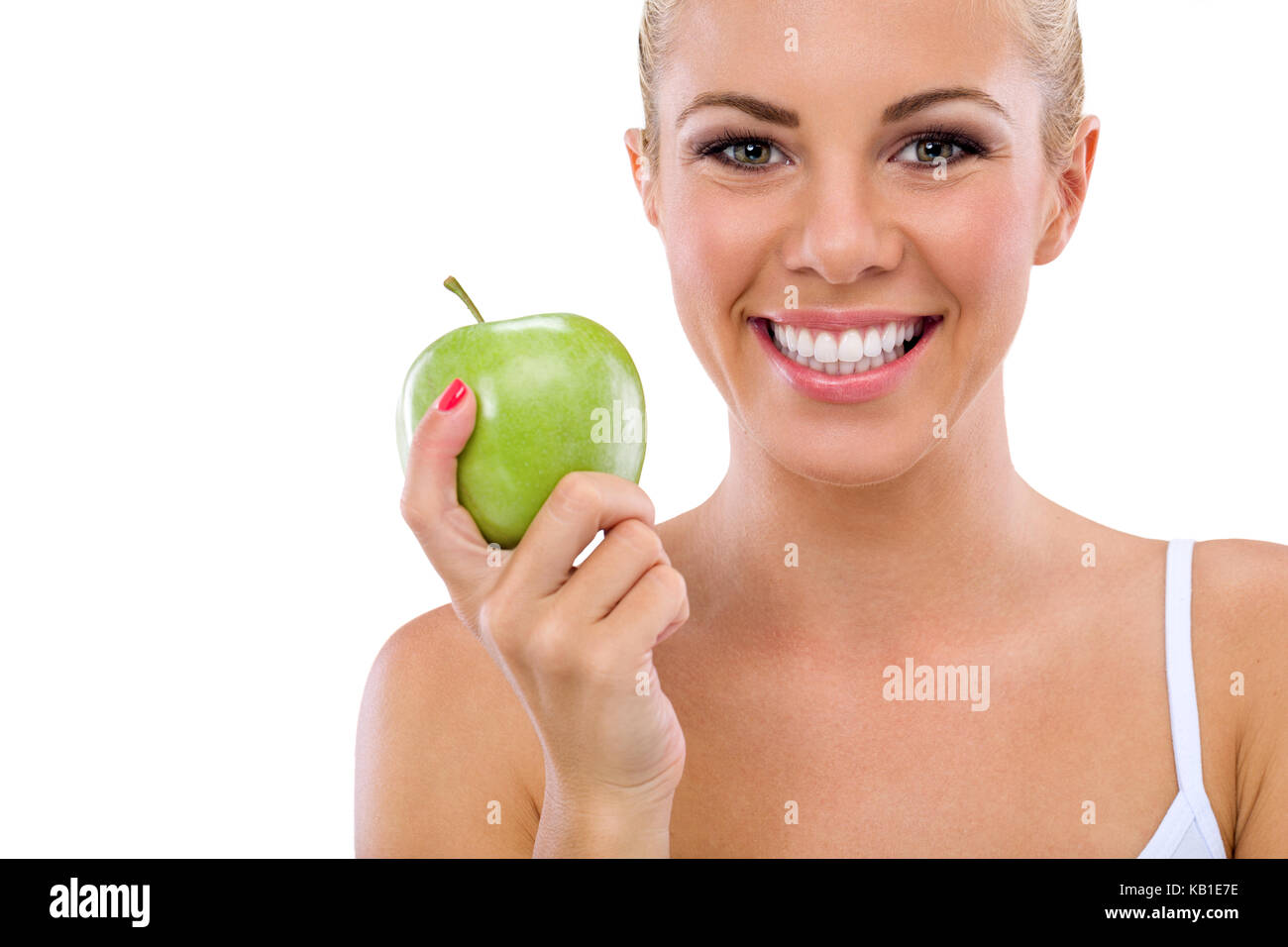 smiling woman with healthy teeth holding green apple Stock Photo - Alamy