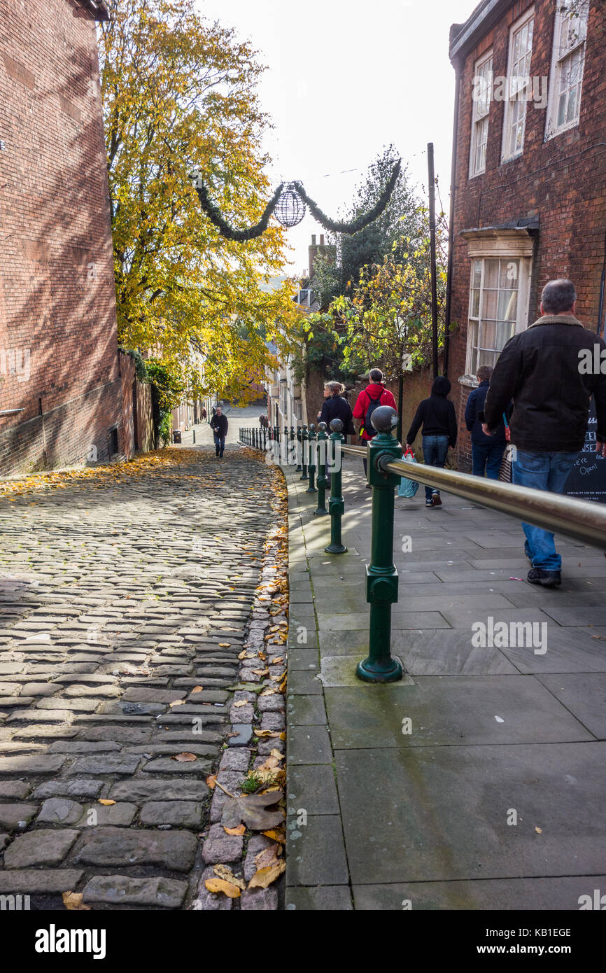 Cobbled footpath down hill with hand rail Lincoln England Stock Photo ...