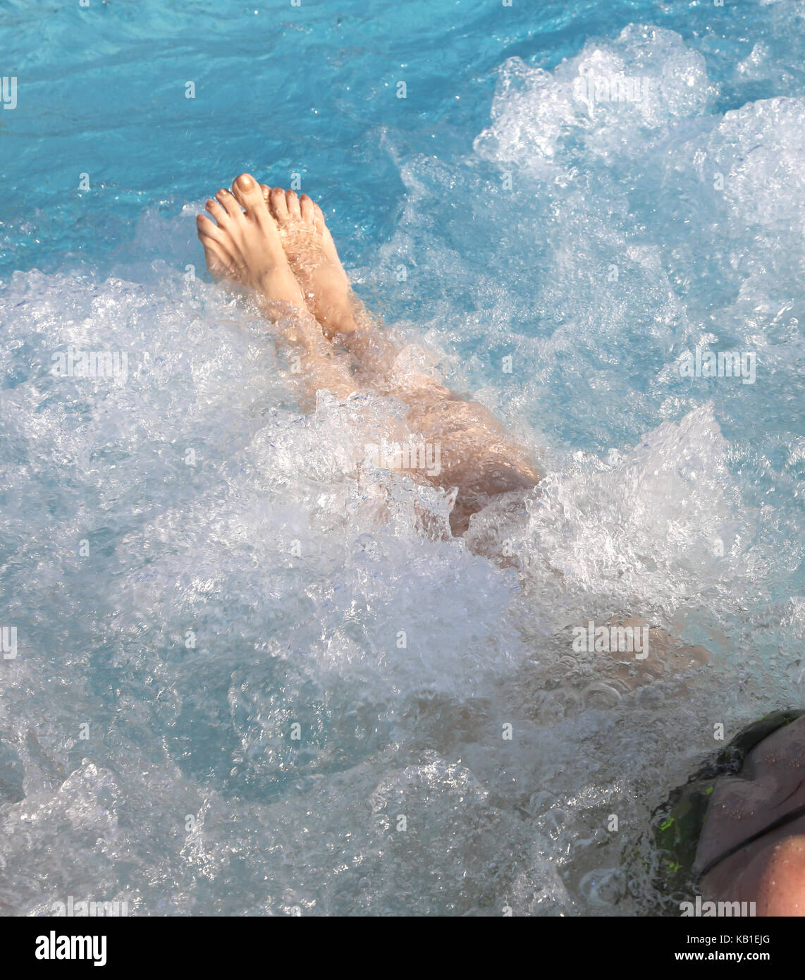 barefoot young woman while taking bath in the thermal pool Stock Photo ...