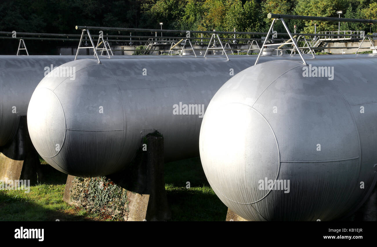 many huge tanks for the storage of methane gas in an industrial zone ...