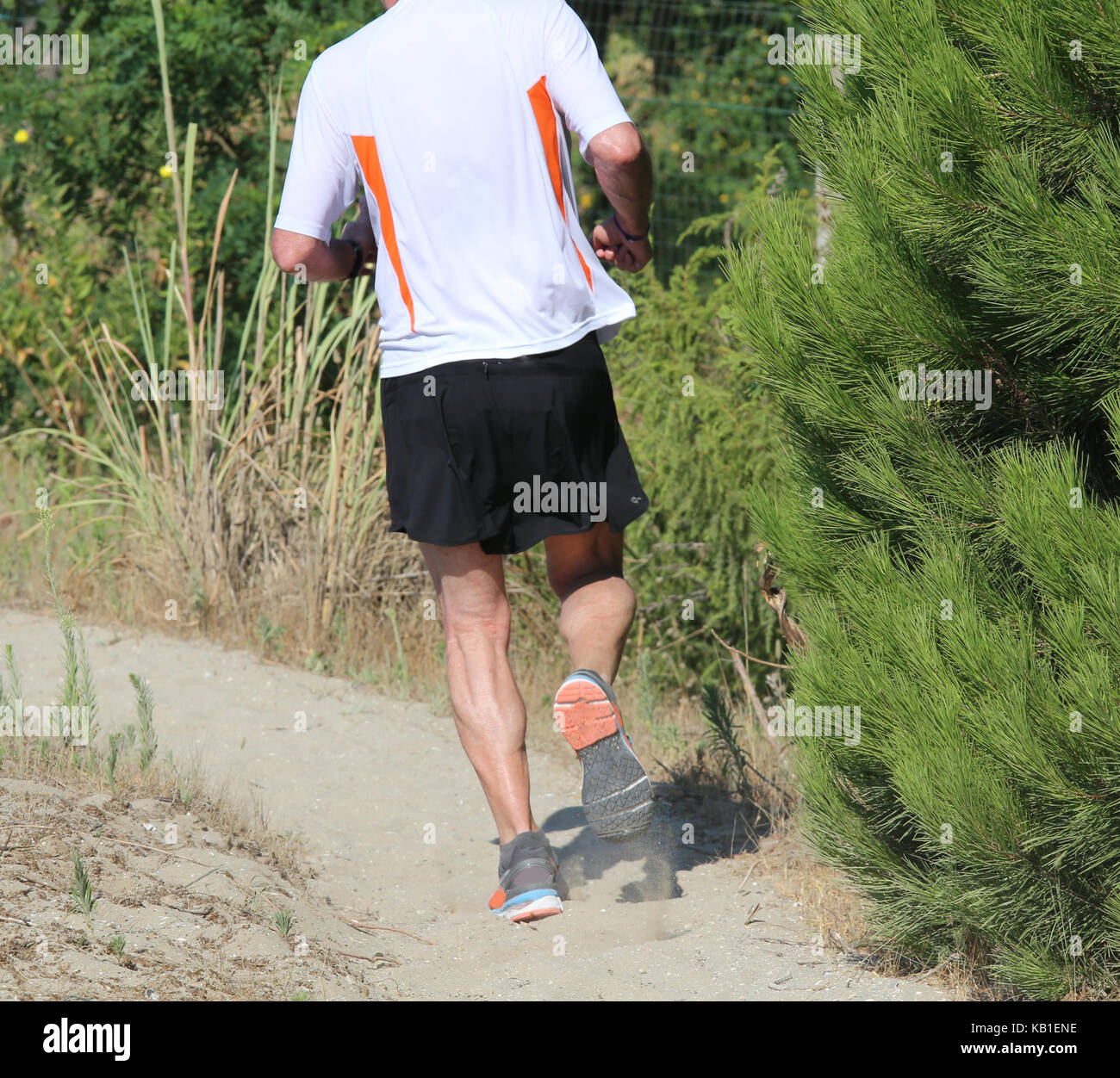 Athletes running around track hi-res stock photography and images - Alamy