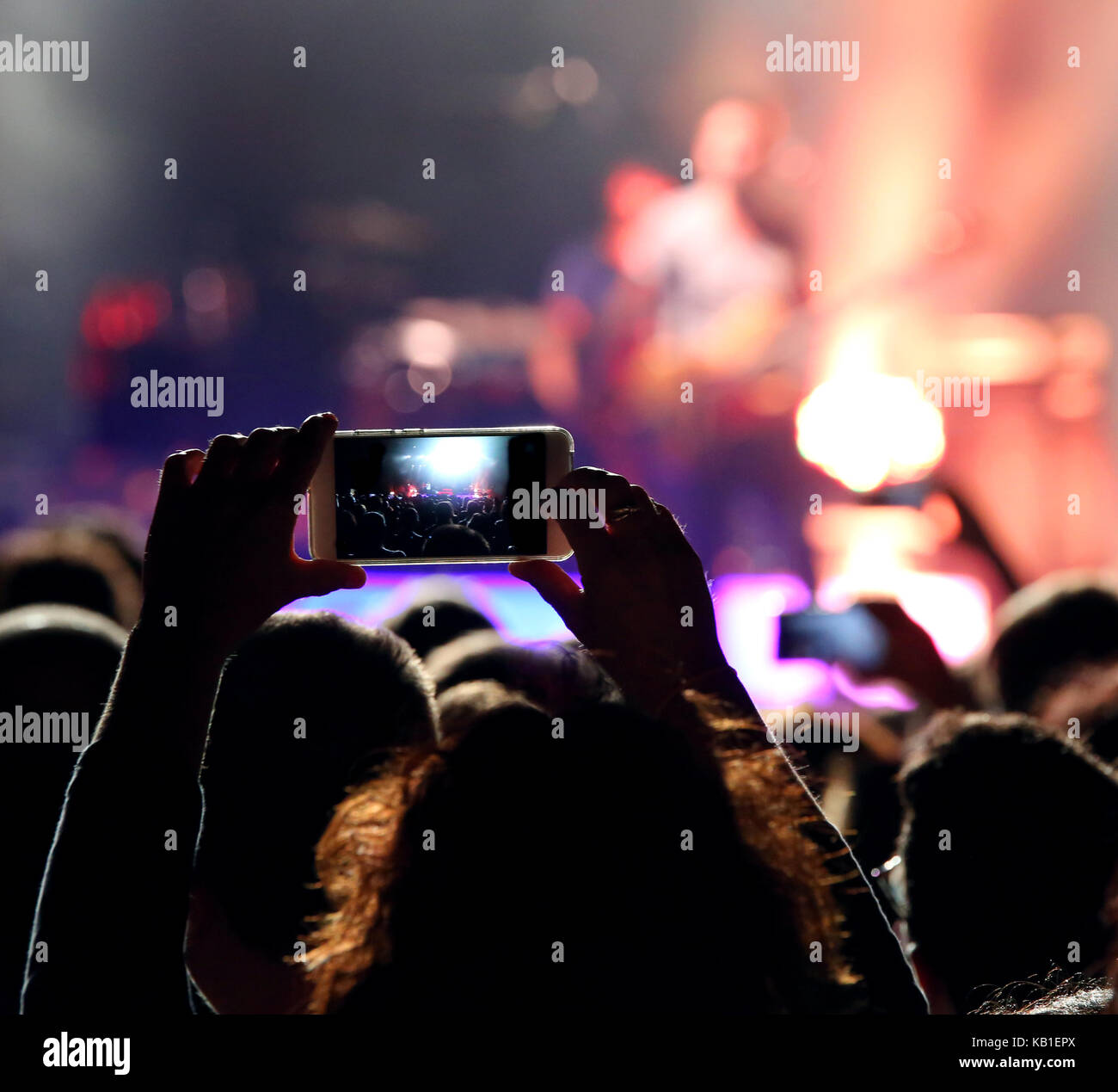 recording movies with modern smartphones during live concert of a rock ...