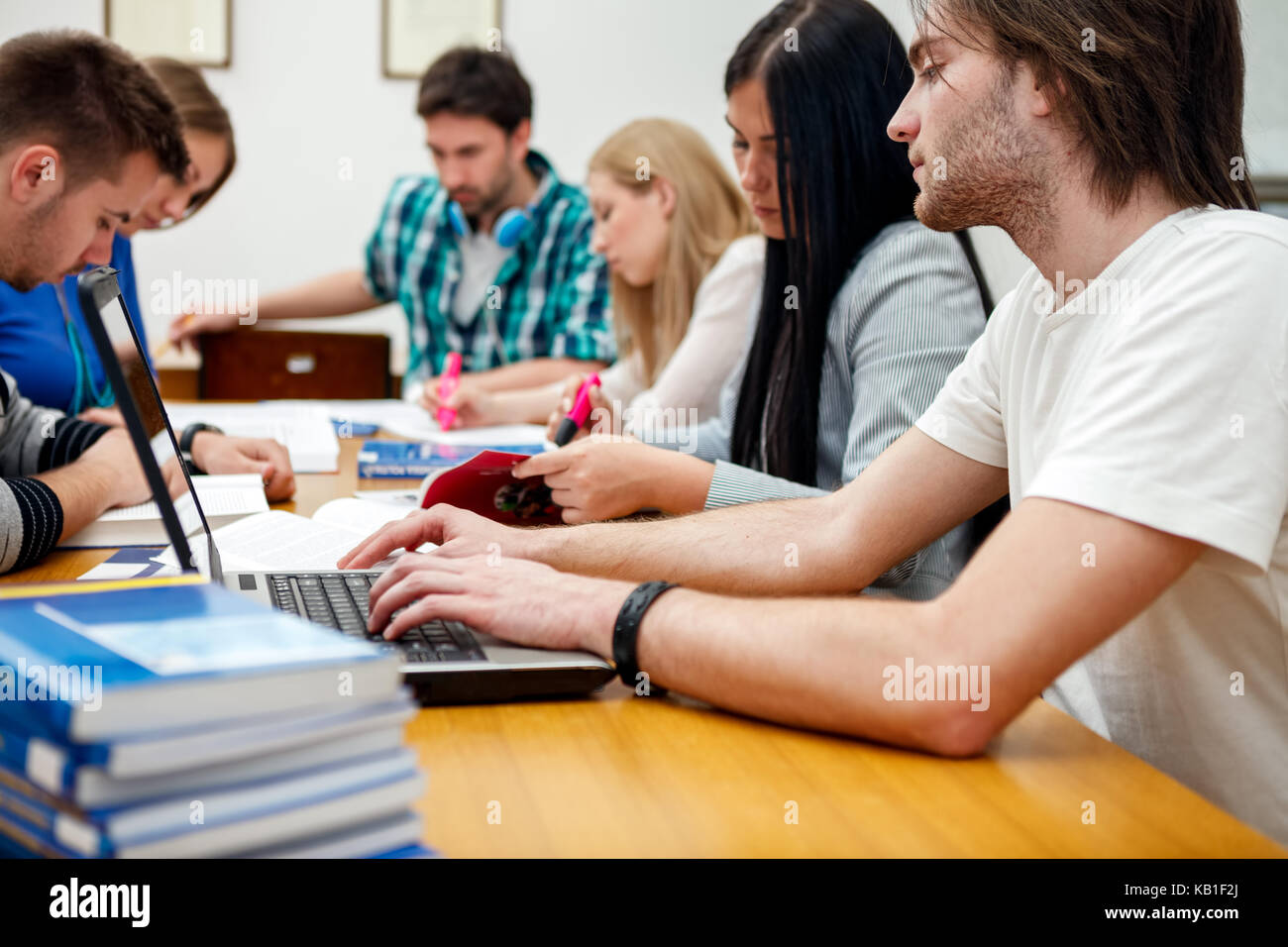 University student learning in classroom Stock Photo - Alamy