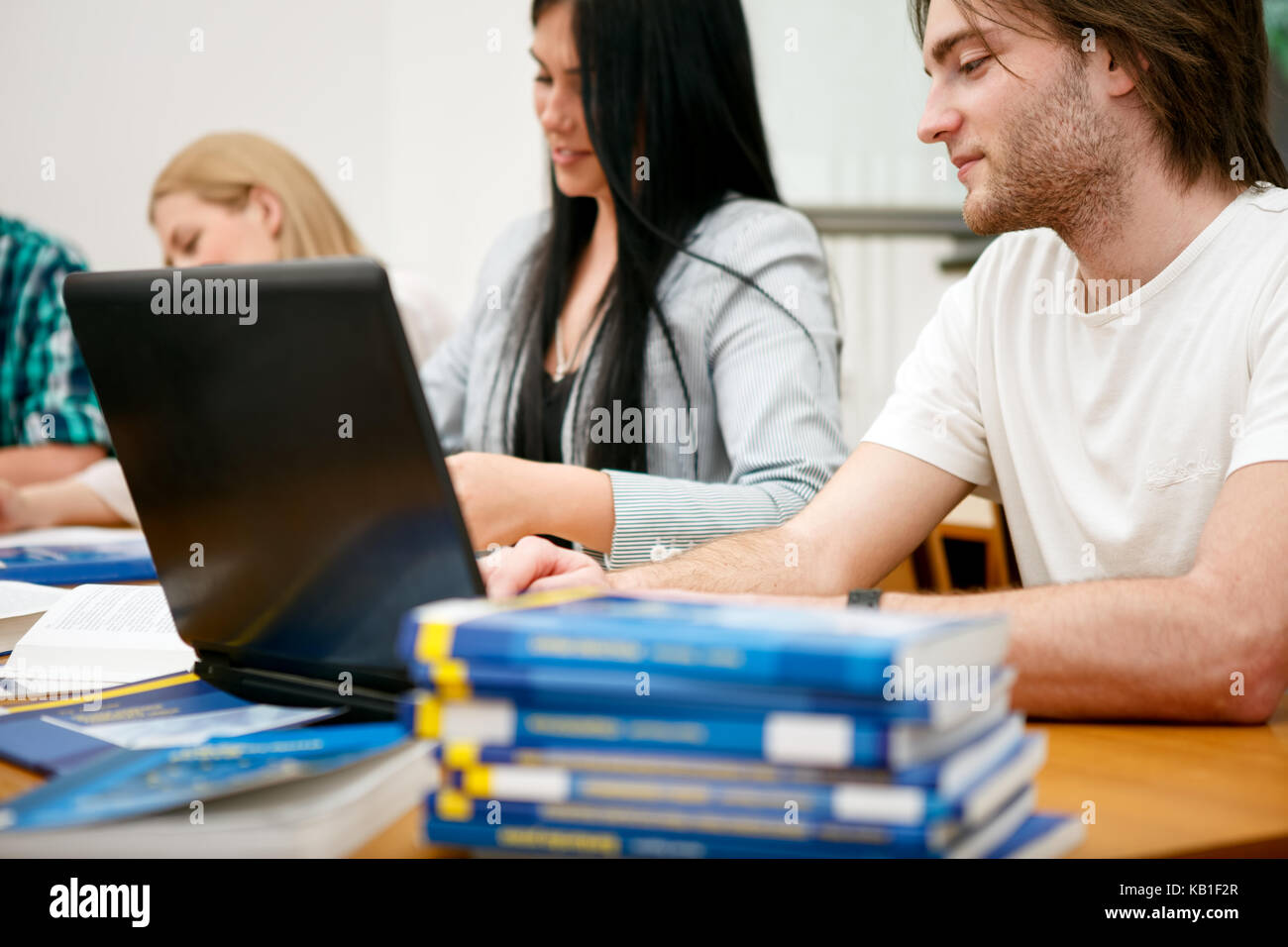 Students learning together in class in university Stock Photo - Alamy