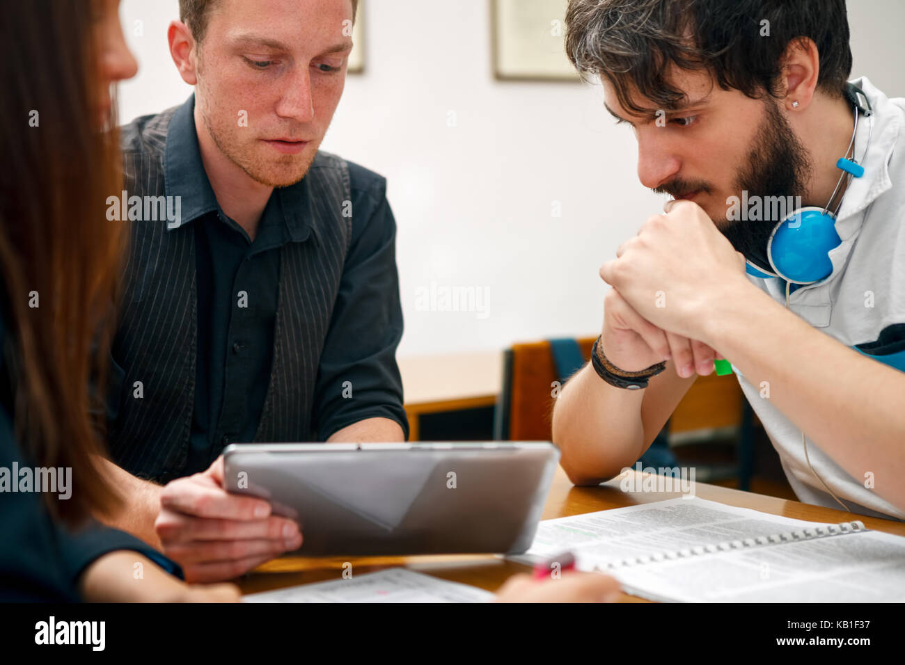 Group of young people using tablet Stock Photo - Alamy