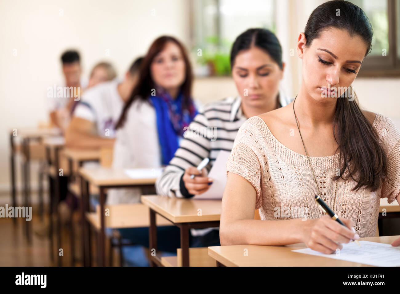 group of students studying together in a classroom Stock Photo - Alamy