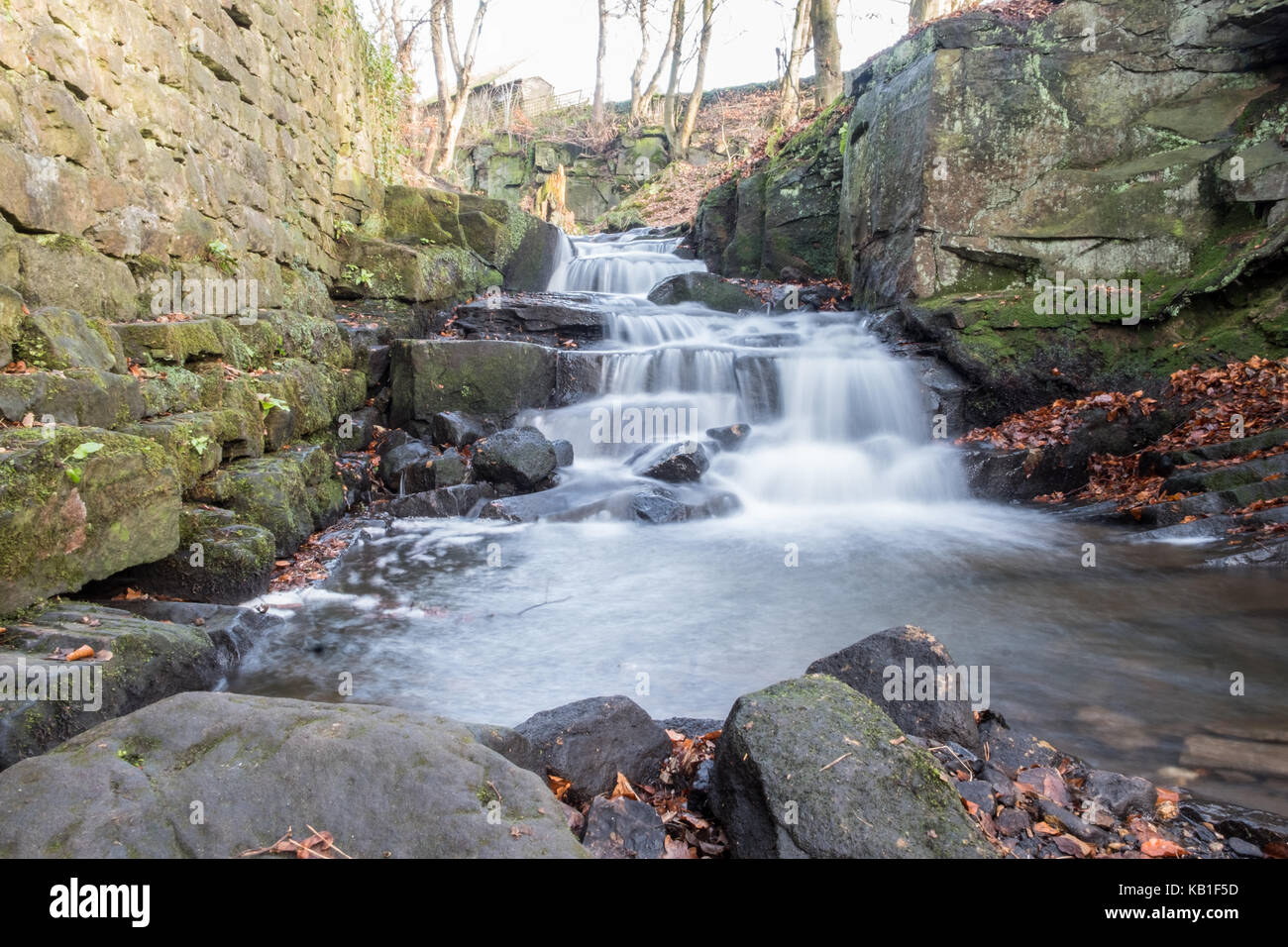 Downhill stream with waterfall through Derbyshire woodland Stock Photo ...