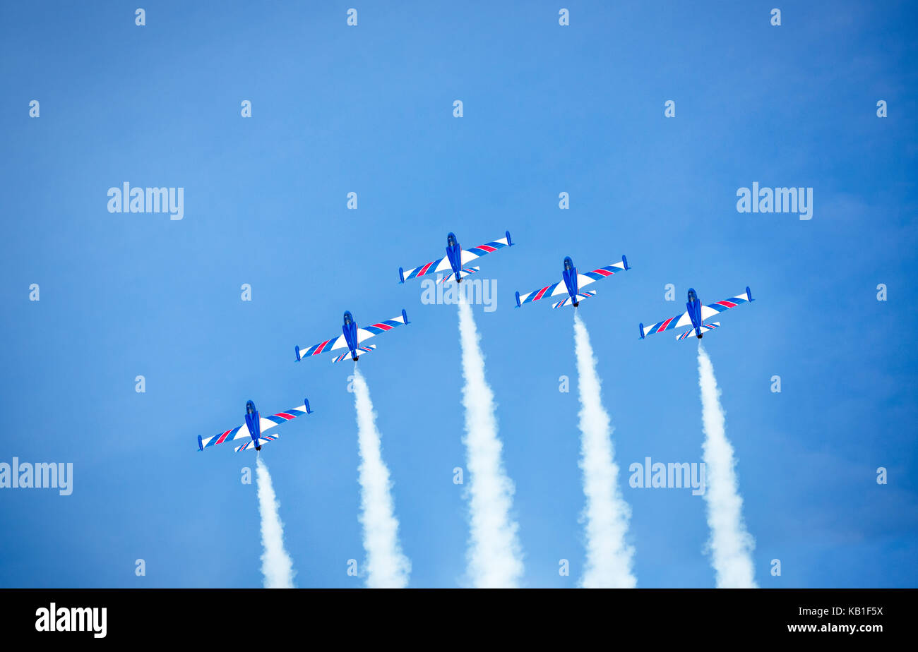 Aerobatic group formation at blue sky during air show Stock Photo - Alamy