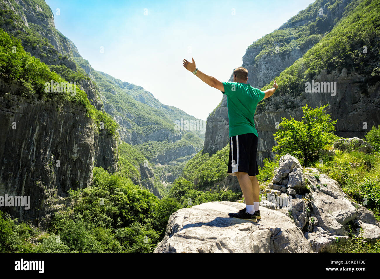 Man standing on stone and enjoying in beautiful nature - freedom ...