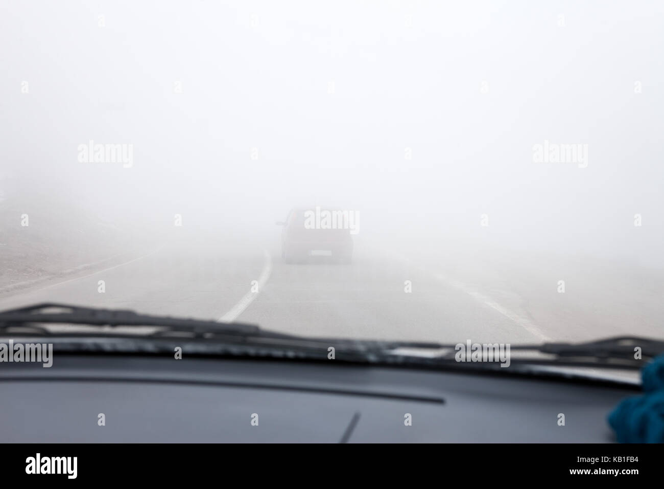 Car driving the Fog Road Stock Photo - Alamy