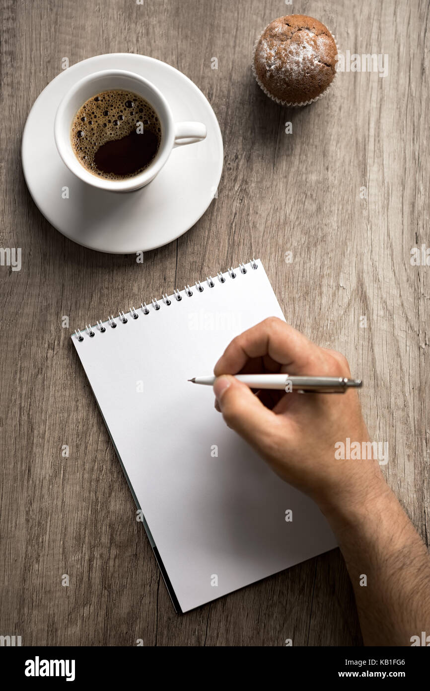 Male hand with pen on empty paper, writing on coffee break Stock Photo ...