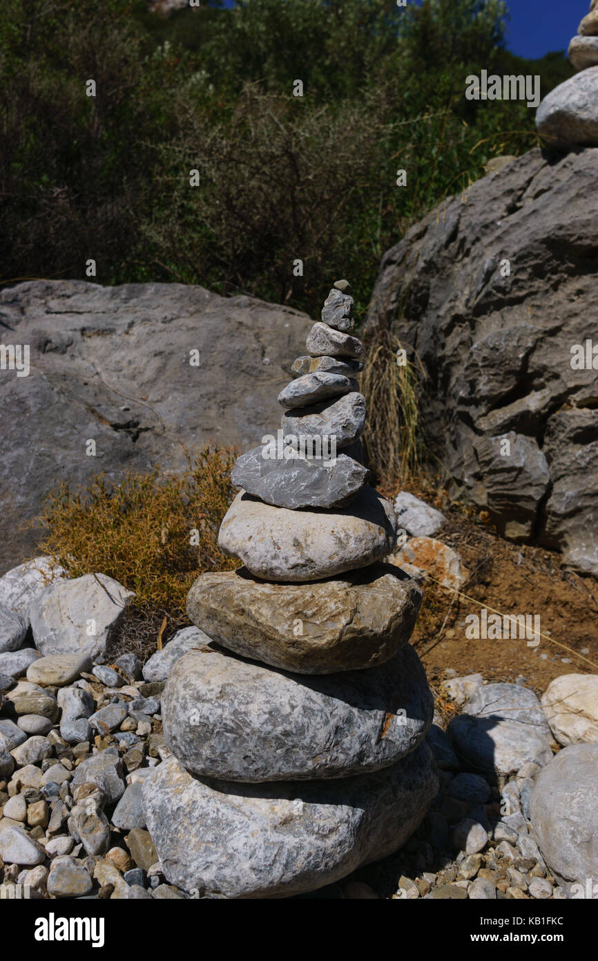 Zen Stones with rocks in the background on crete greece Stock Photo - Alamy