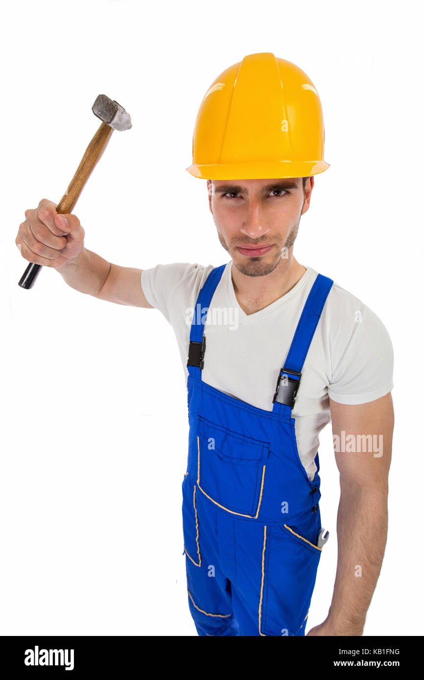 Angry young construction worker with a hammer Stock Photo - Alamy