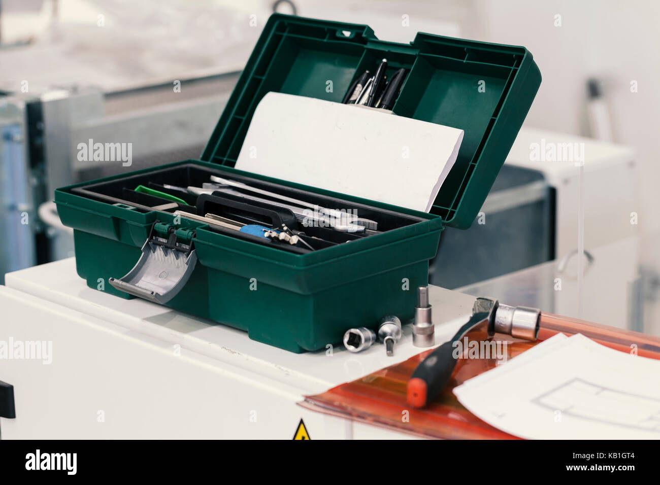 open green tool box on machine Stock Photo - Alamy