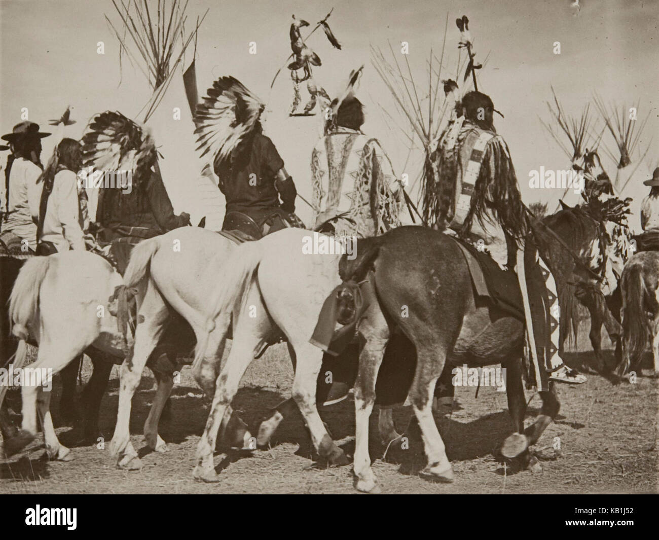 Untitled (Rear view of Native Americans riding Stock Photo - Alamy
