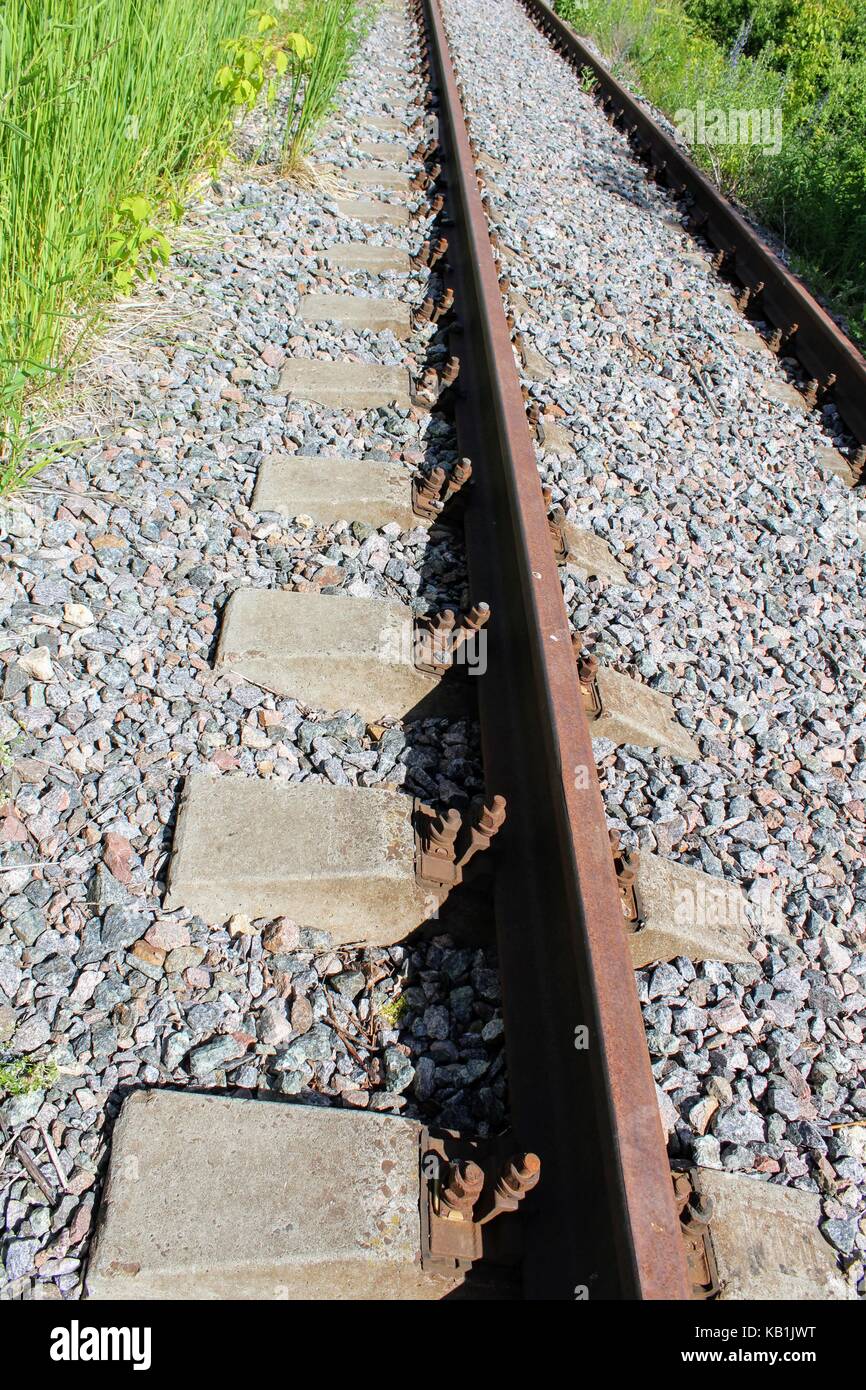 Rusty track rails. The railway track itself is new, the rails rust from ...