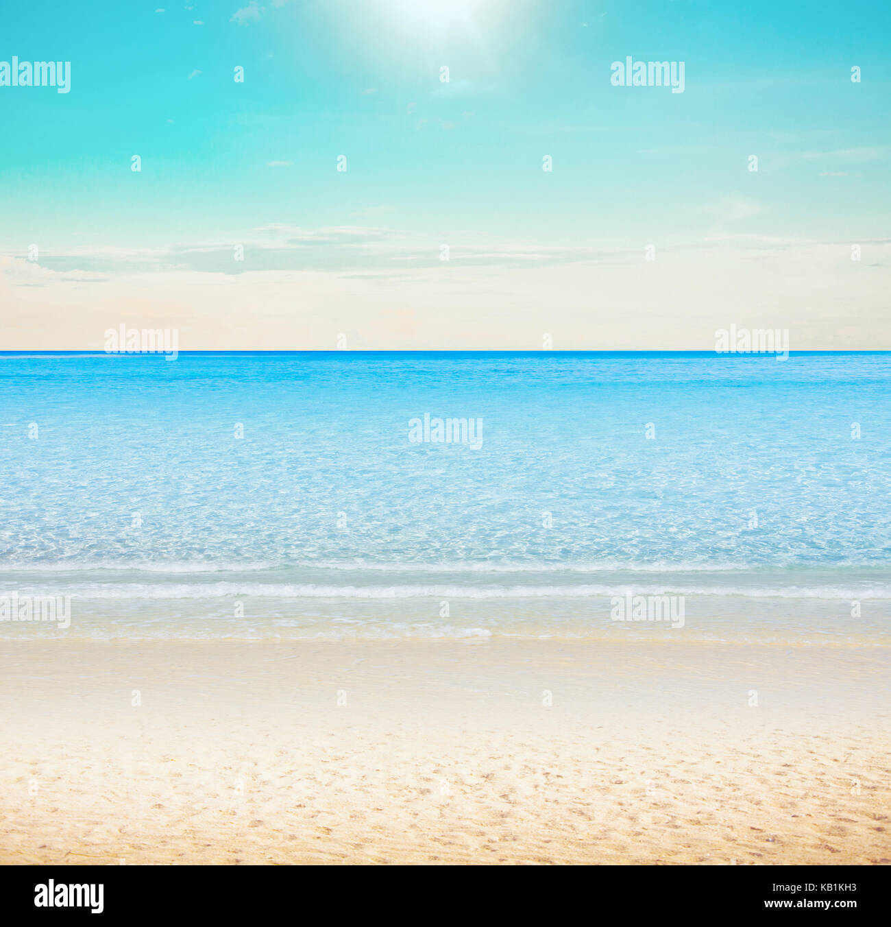 Sun over tropical beach Stock Photo - Alamy