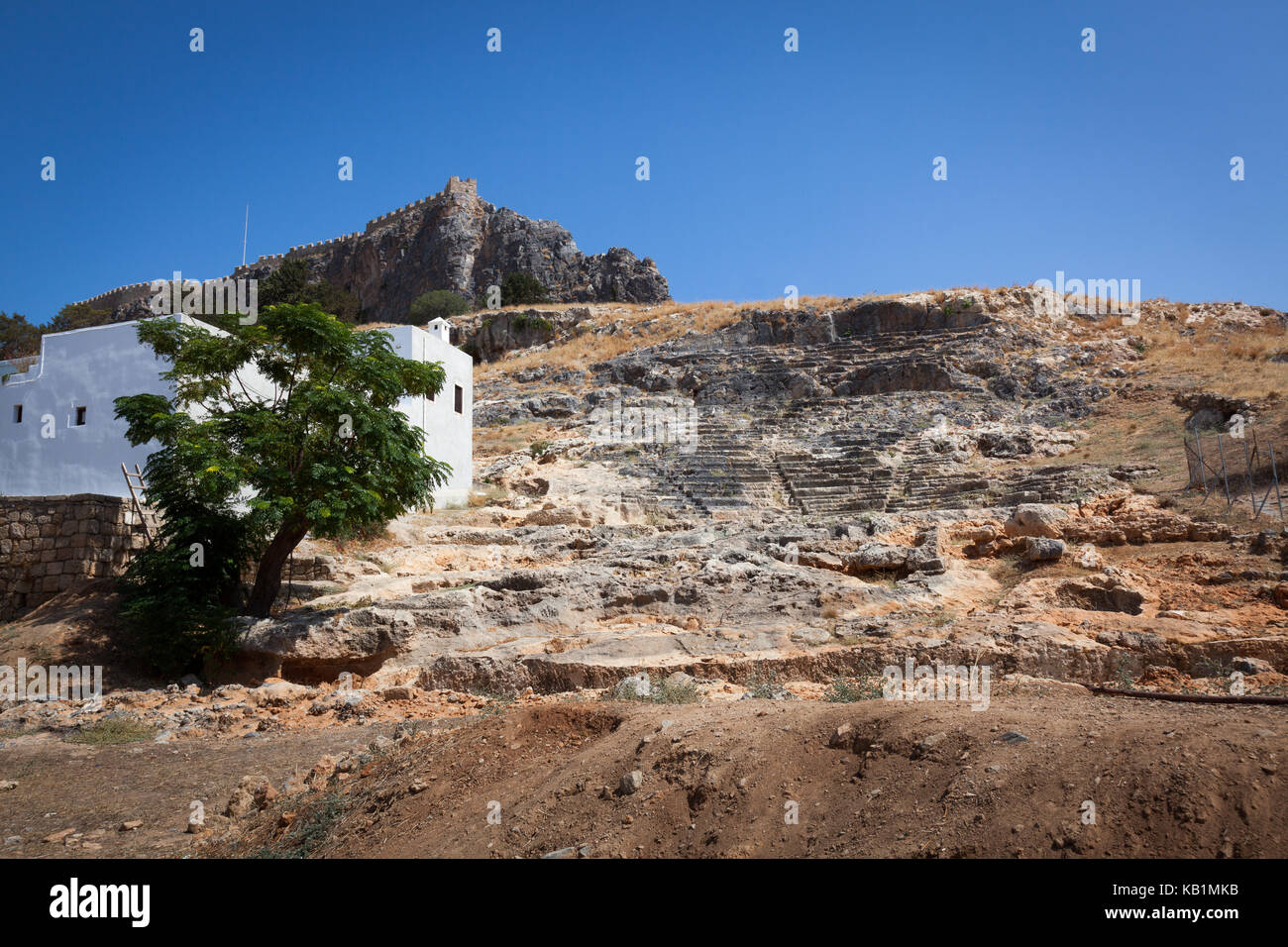 The remains of the amphitheatre in Lindos on the Greek island of Rhodes ...