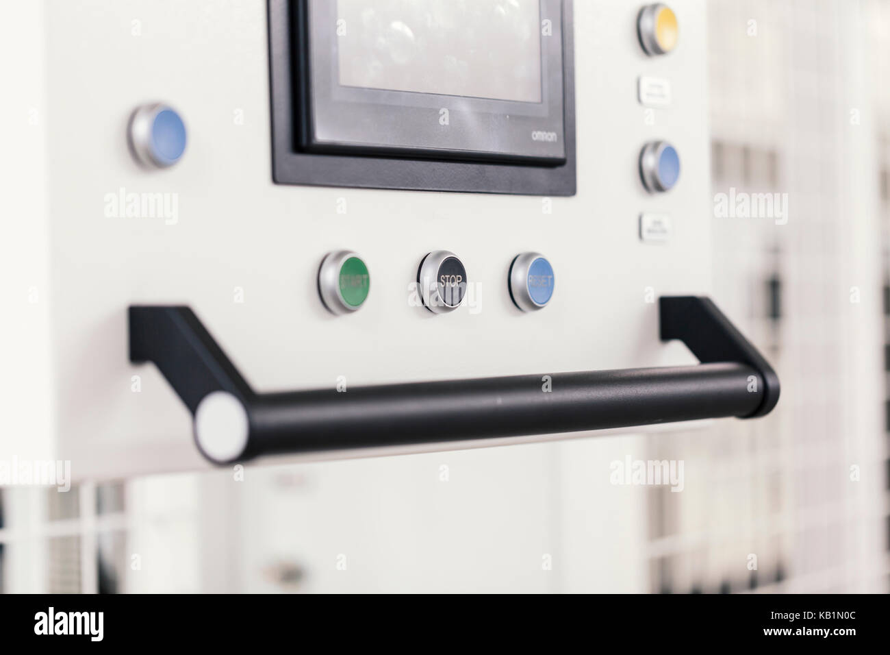 emergency stop red button with key on machine Stock Photo - Alamy