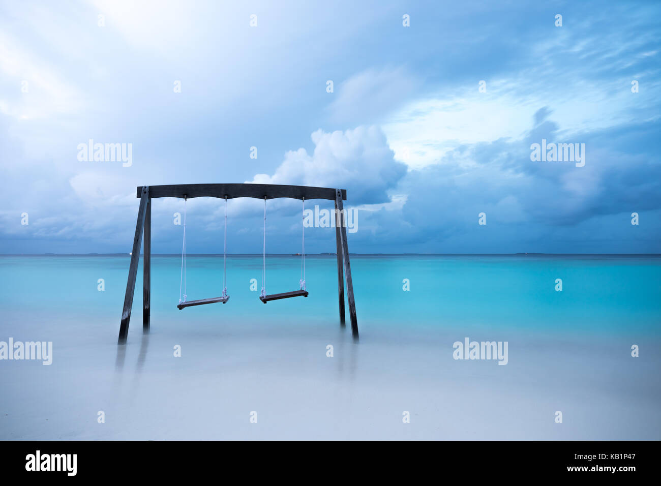View of a swing at sunrise at seaside. Maldives Stock Photo - Alamy