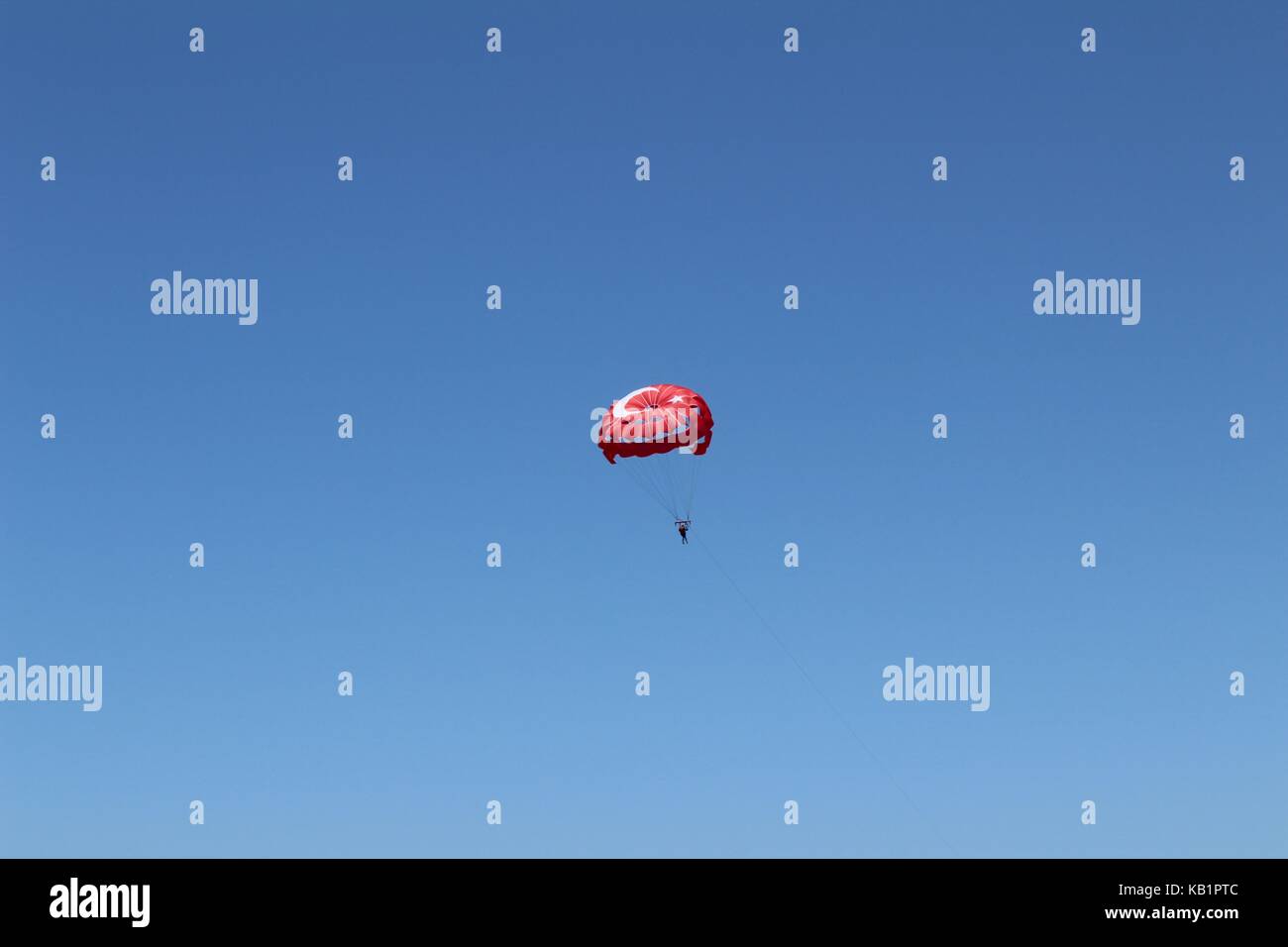 A parachute with a passenger painted in the colors of the Turkish flag ...