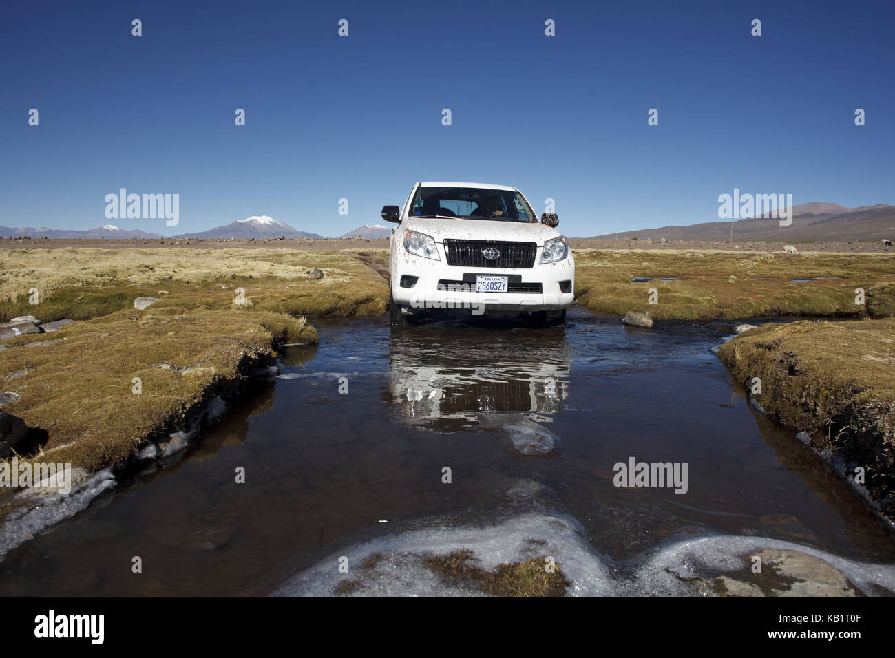 Bolivia, the Andes, car, river way through Stock Photo - Alamy