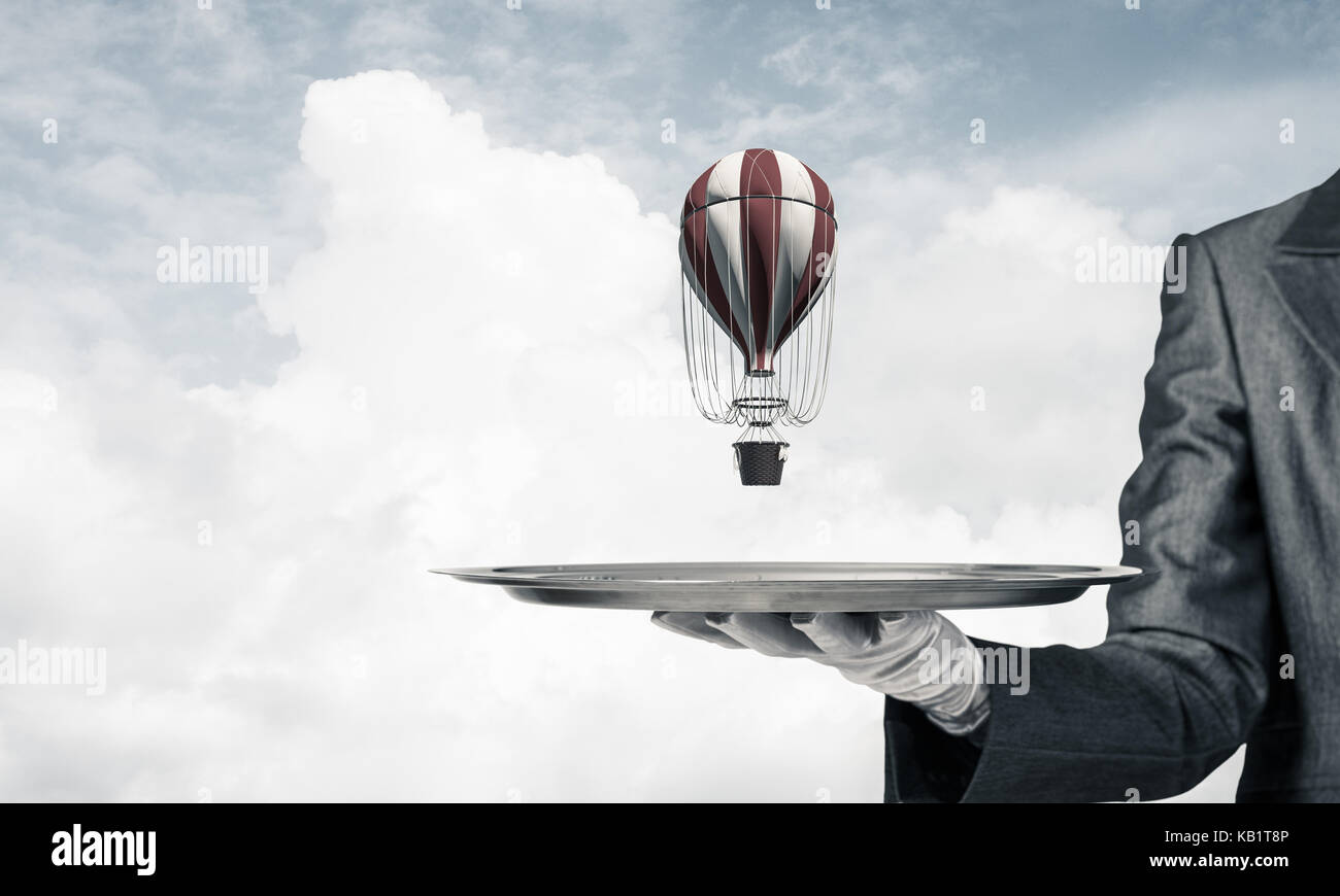 Hand of waiter presenting balloon on tray Stock Photo - Alamy