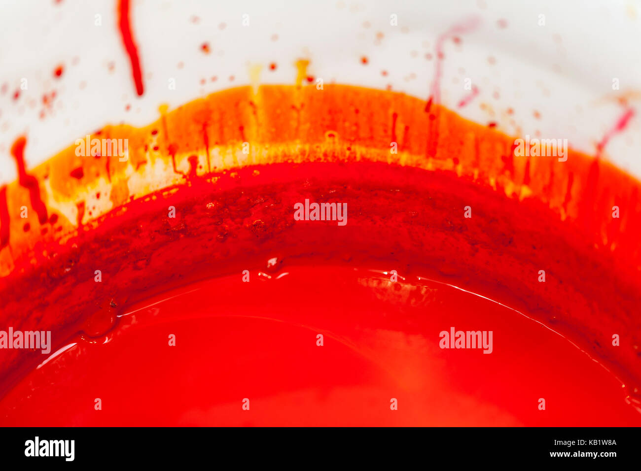 red paint in bucket, close up Stock Photo - Alamy