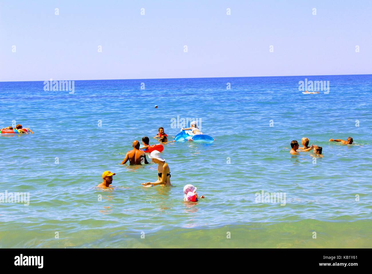 July, 2017 - Vacationers bathe in the sea and sunbathe in the sun on ...
