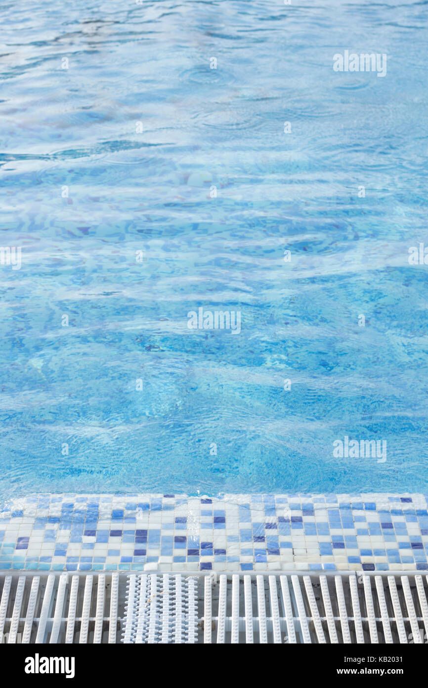 Blue swimming pool on hot sunny day on summer vacation Stock Photo - Alamy